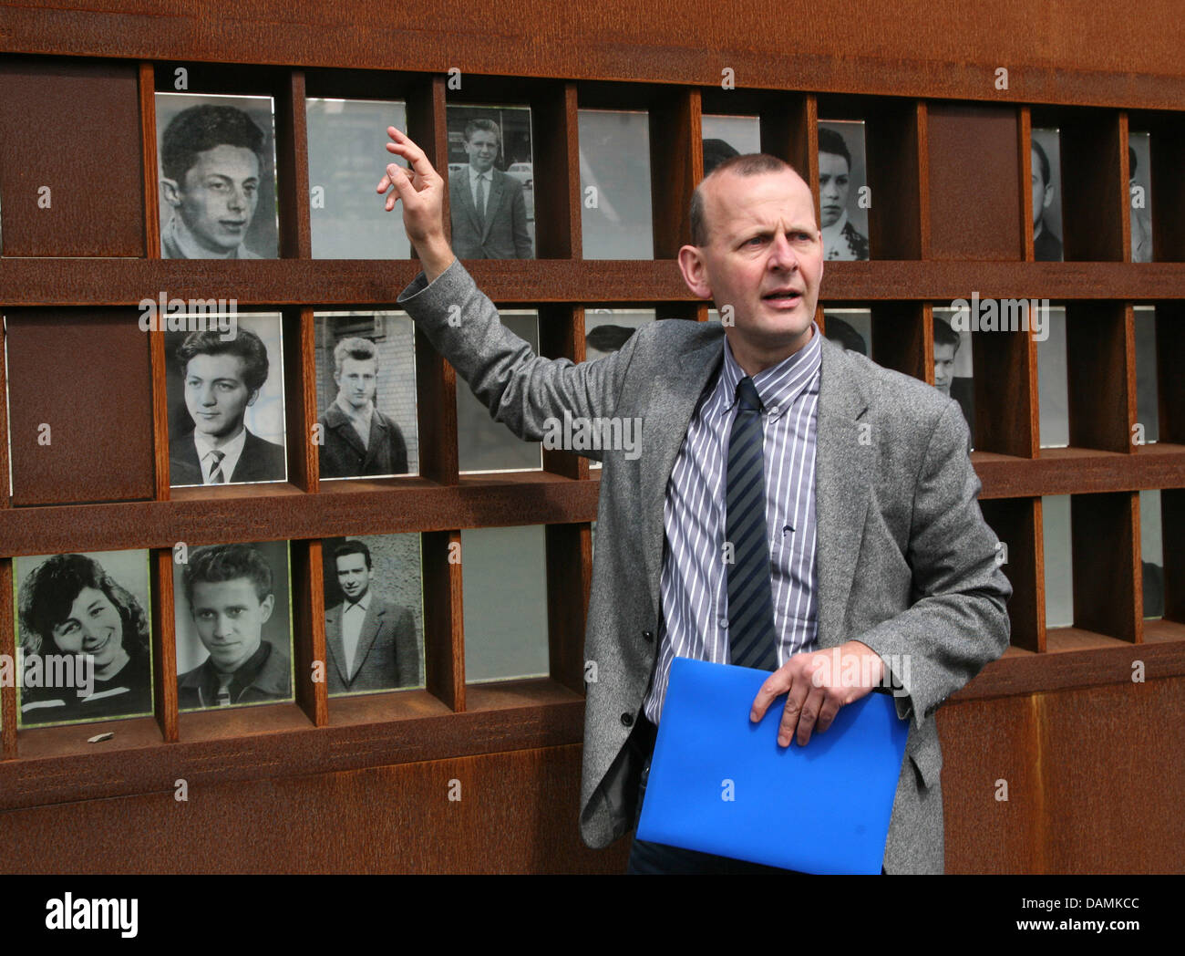 The director of the Berlin Wall Foundation Axel Klausmeier points at ...
