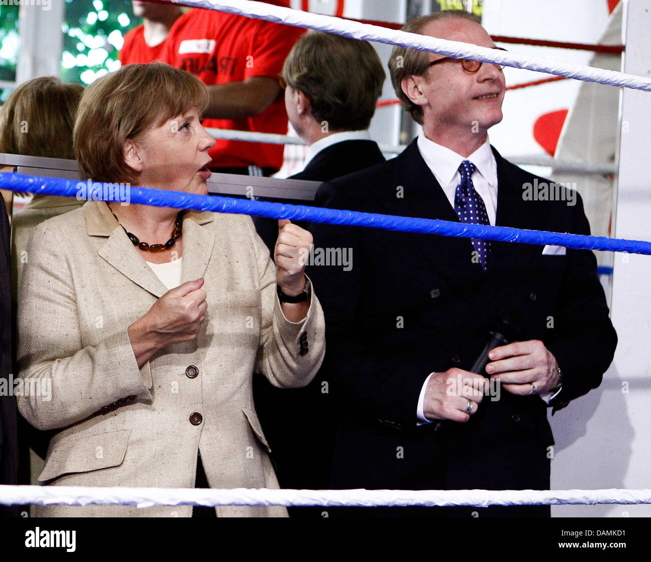 German Chancellor Angela Merkel (L) watches a boxing fight at a youth ...