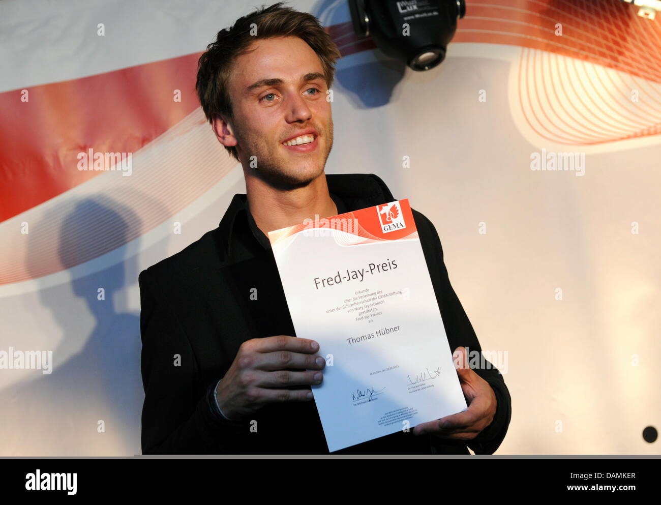 German singer Clueso holds his certification for the Fred Jay Prize in ...