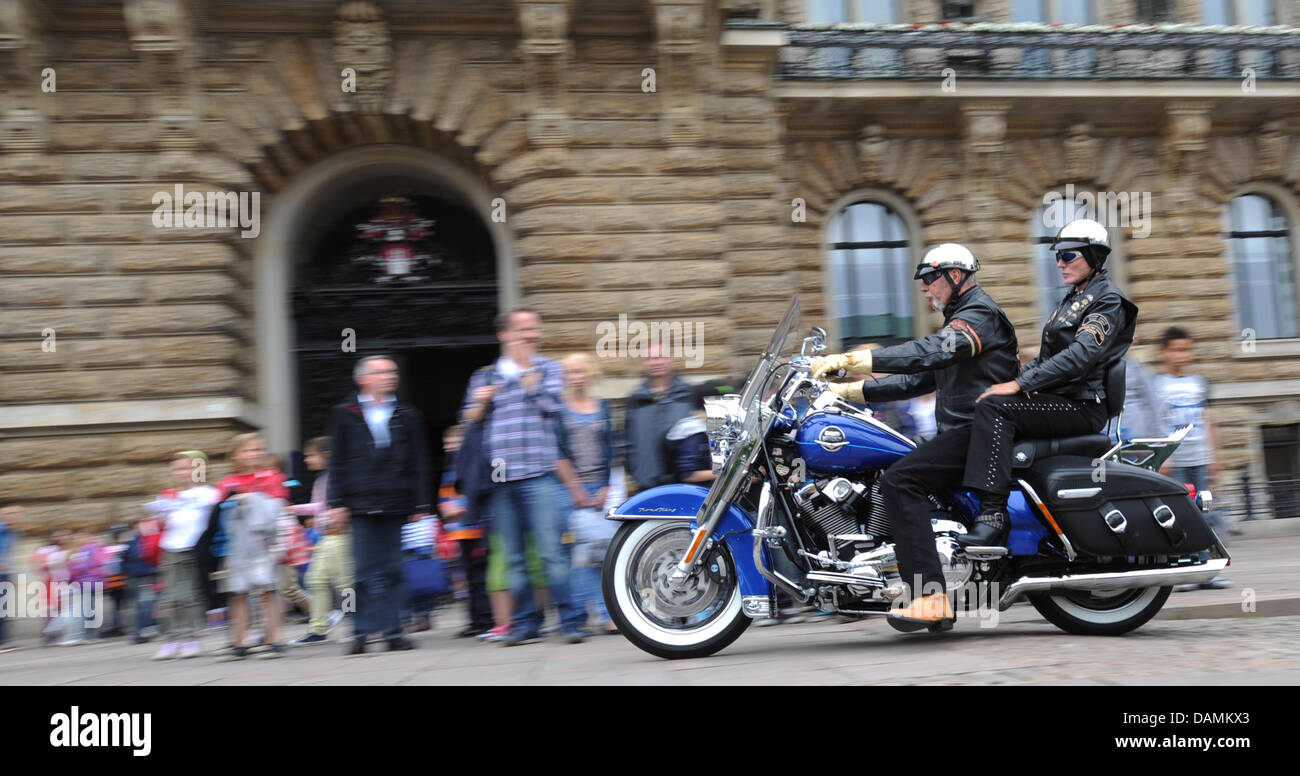 Harley Davidson fans ride in front of city hall in Hamburg, Germany, 21 ...
