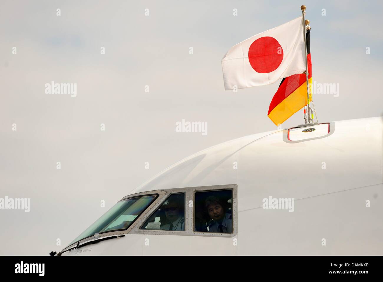 The German and the Japanese flag hang above the windshield of Japan's ...