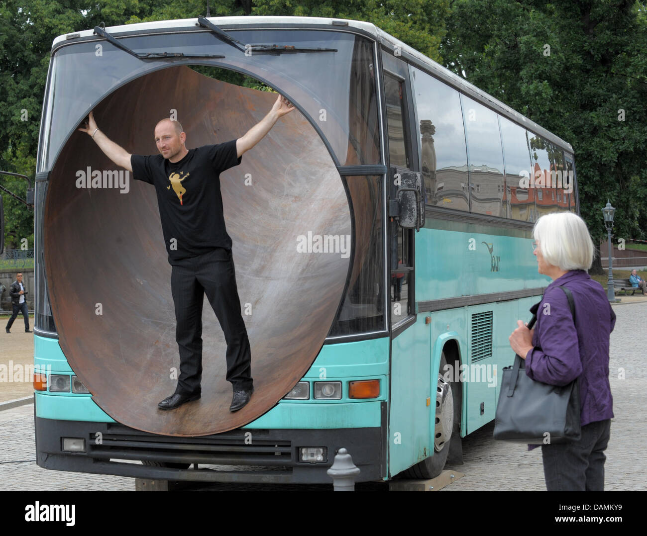 Czech artist Lukas Rittstein poses in his sculpture 'Tour' in Dresden ...