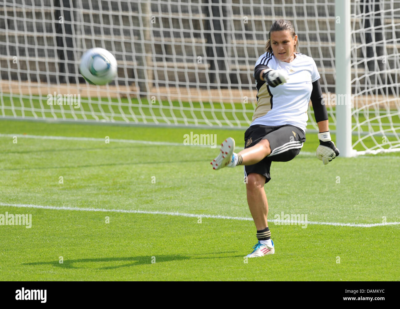 German goalkeeper Nadine Angerer plays the ball during a practice ...