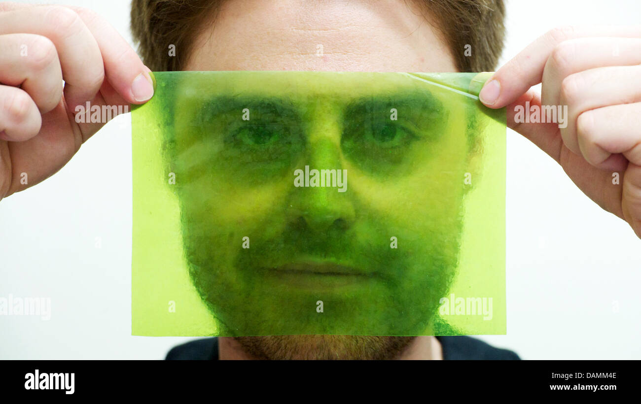 A newly invented biodegradable foil is presented by the head of the ...