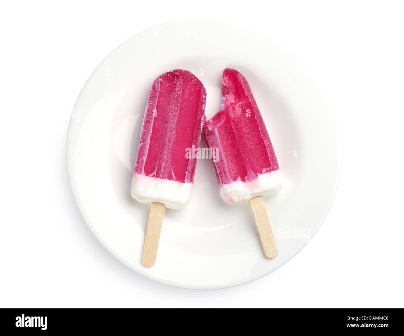 Two popsicle on a white plate Stock Photo - Alamy