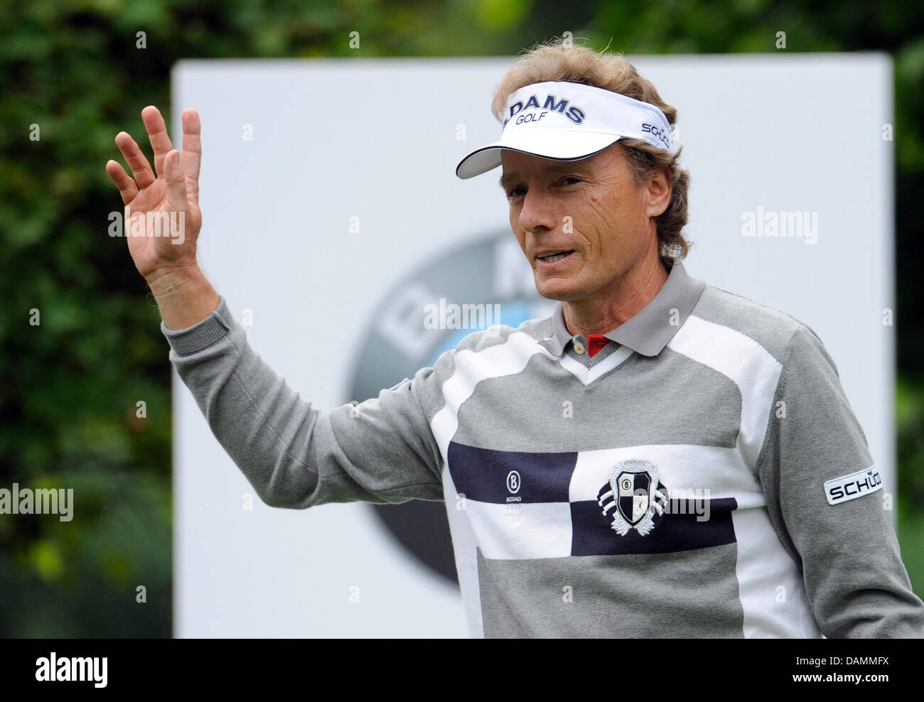 German golf pro Bernhard Langer waves to the spectators at the BMW Open ...