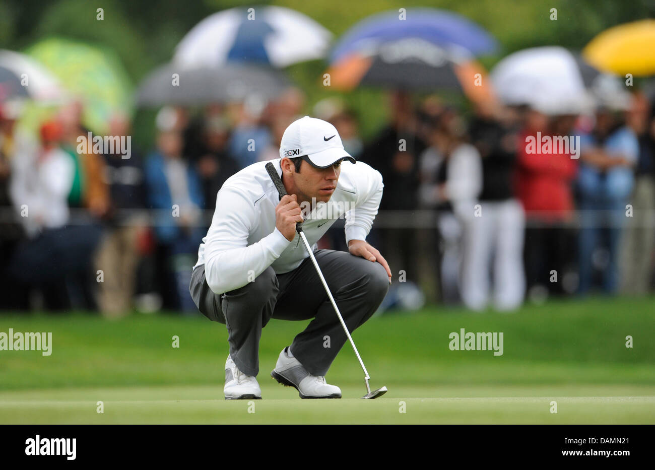 English professional golfer Paul Casey eyes the distance of his putt at ...
