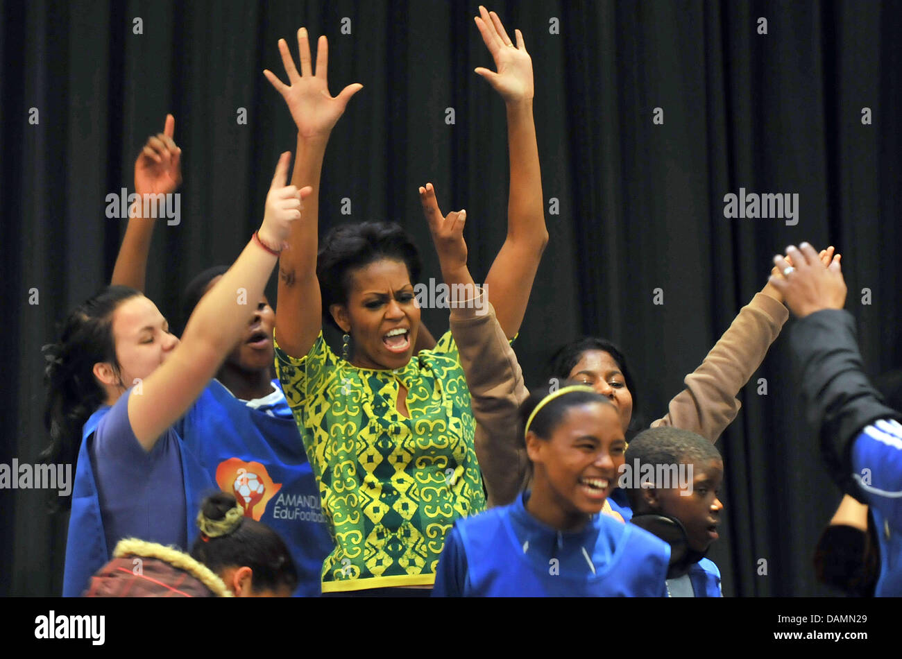 US First Lady Michelle Obama is raising arms when she met kids of a ...