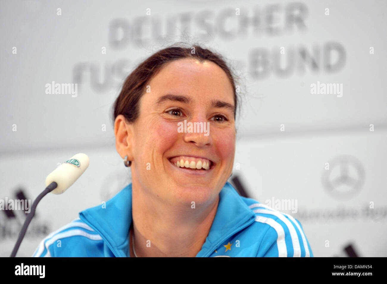 The German national women's soccer team player, Birgit Prinz, smiles at ...