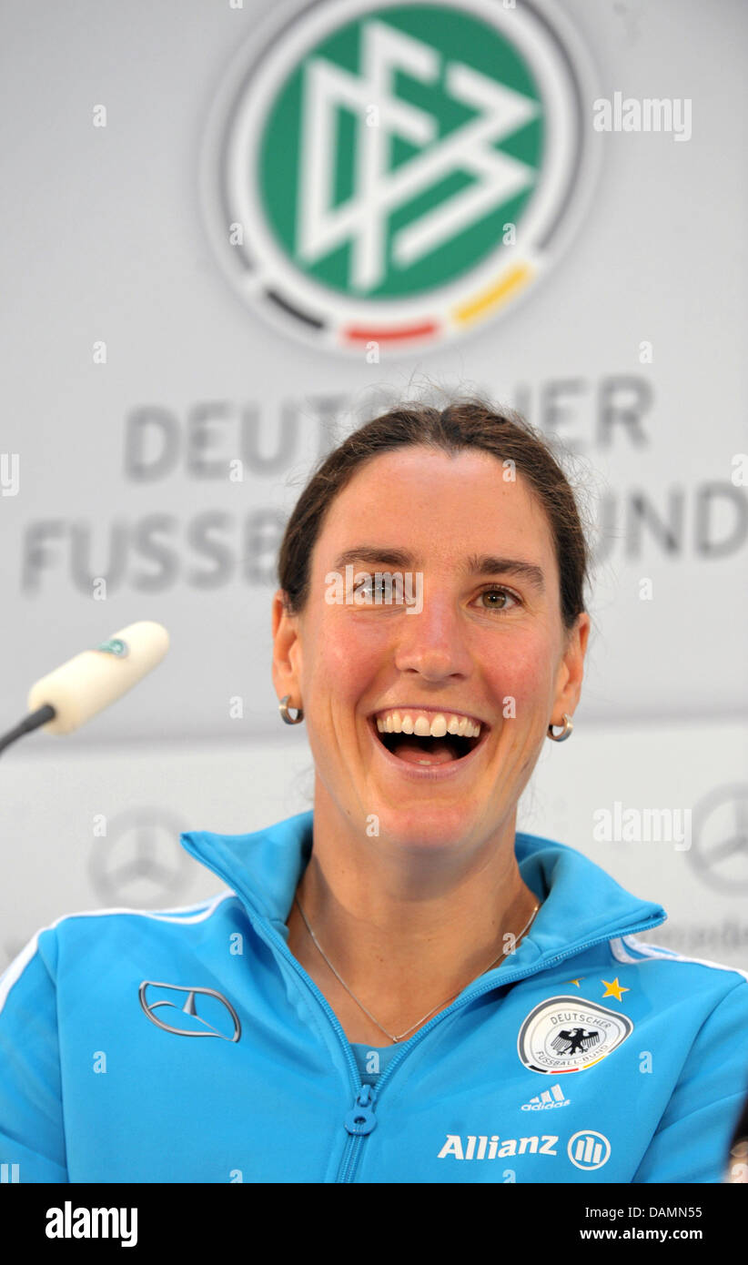 The German national women's soccer team player, Birgit Prinz, smiles at ...