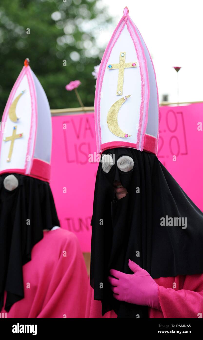 Participants wear extraordinarily fancy dresses and make-up at the ...