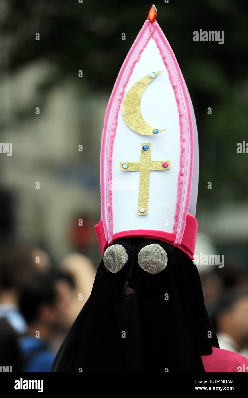 A participant wears extraordinarily fancy dress and make-up at the ...