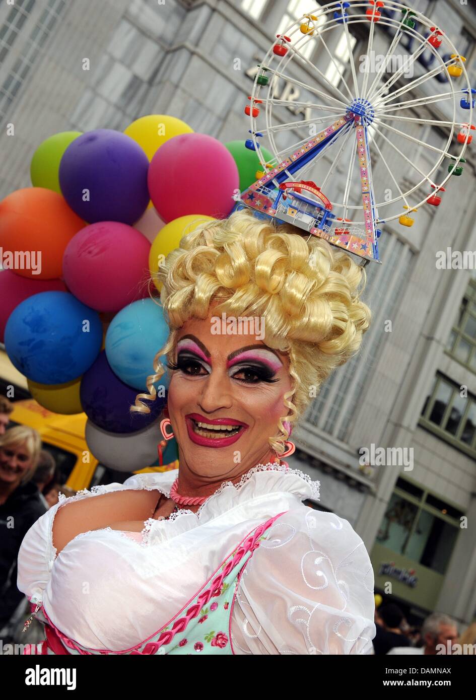 A participant wears extraordinarily fancy dress and make-up at the ...