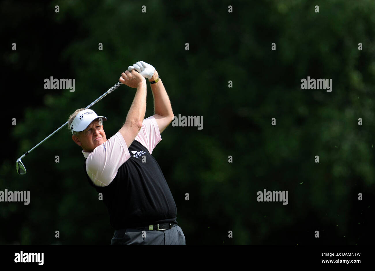 Scottish golf pro Colin Montgomerie drives off at the BMW Open 2011 in ...