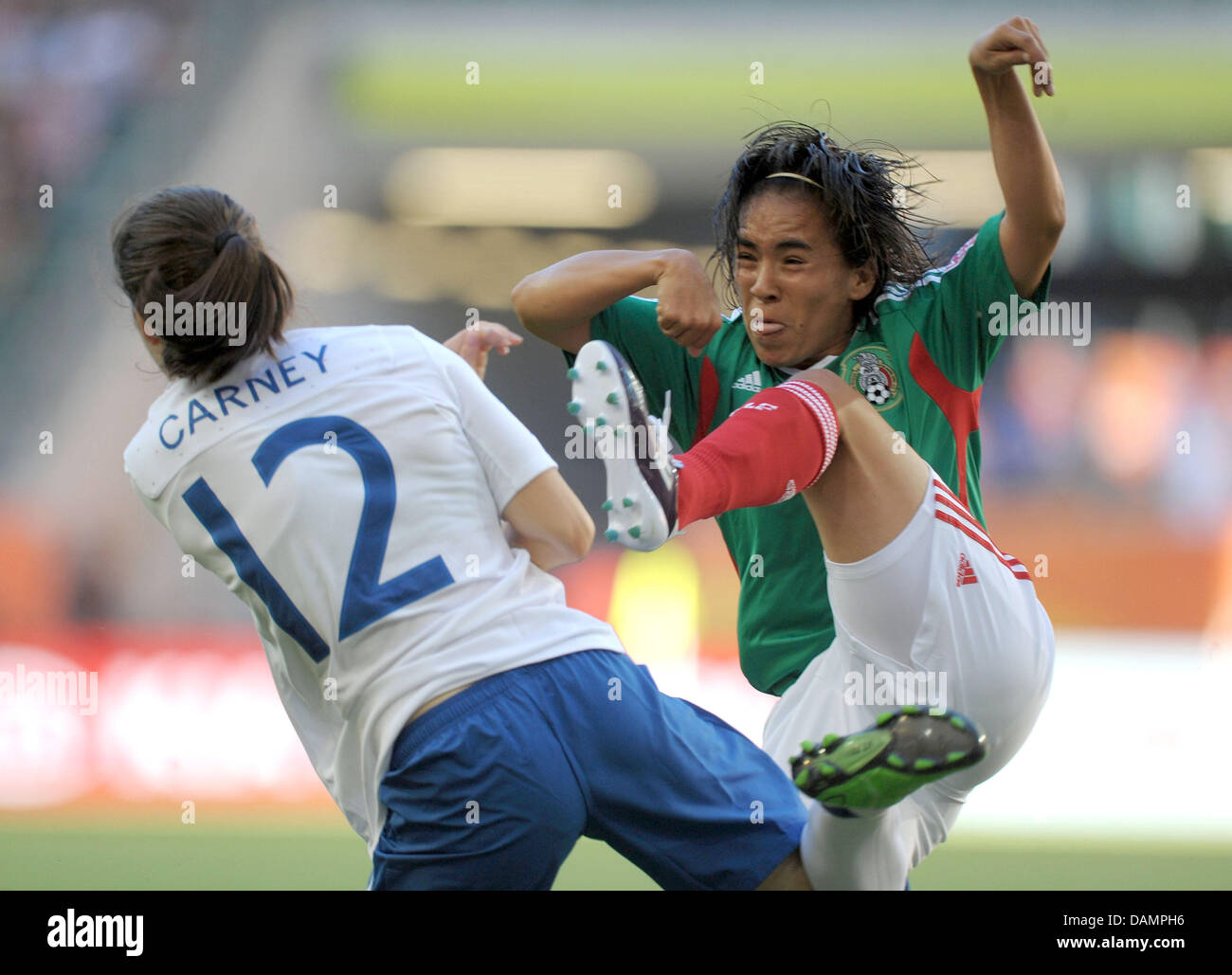 Monica Ocampo of Mexico (r) and Karen Carney of England fight for the ...