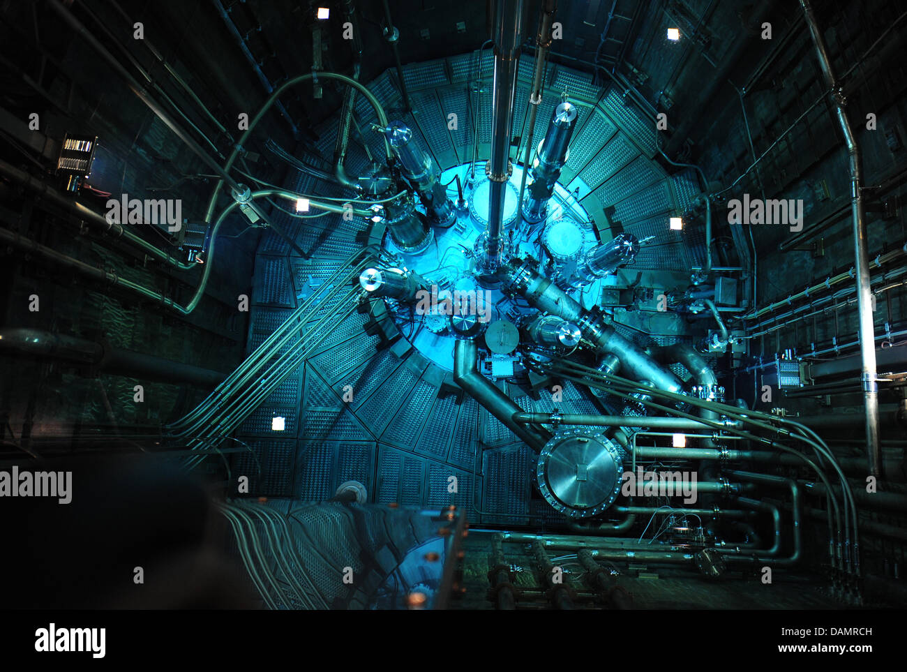 Blue light highlights the section of a cooling pool for nuclear fuel ...