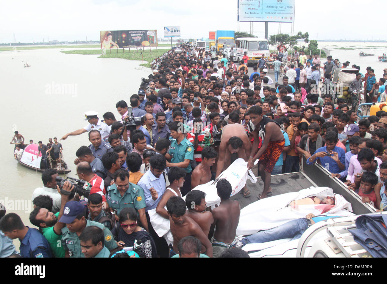Ashulia, Bangladesh. 16th July, 2013. Bangladeshi people watch as ...