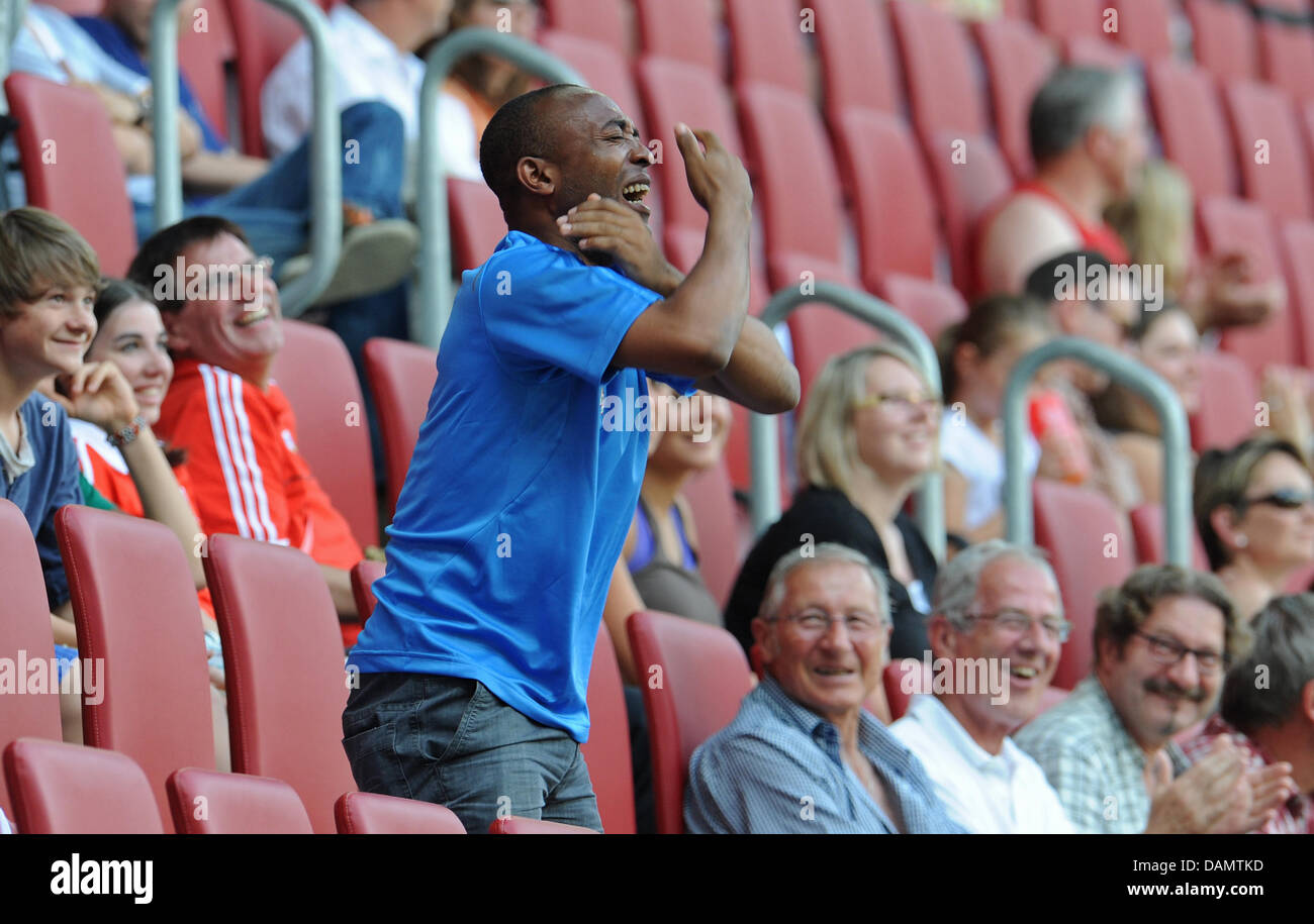A supporter of Equatorial Guinea is disappointed after a missed shot by ...