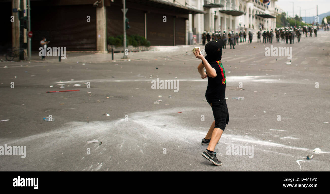 Protesters and police clash in violent riots with a single protester ...