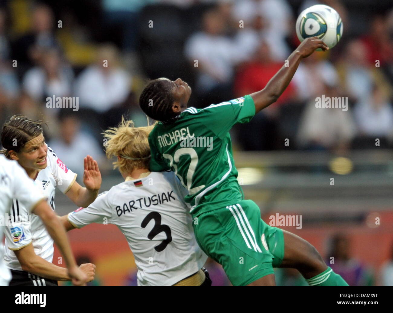 Saskia Bartusiak of Germany (C) and Sarah Michael of Nigeria fight for ...