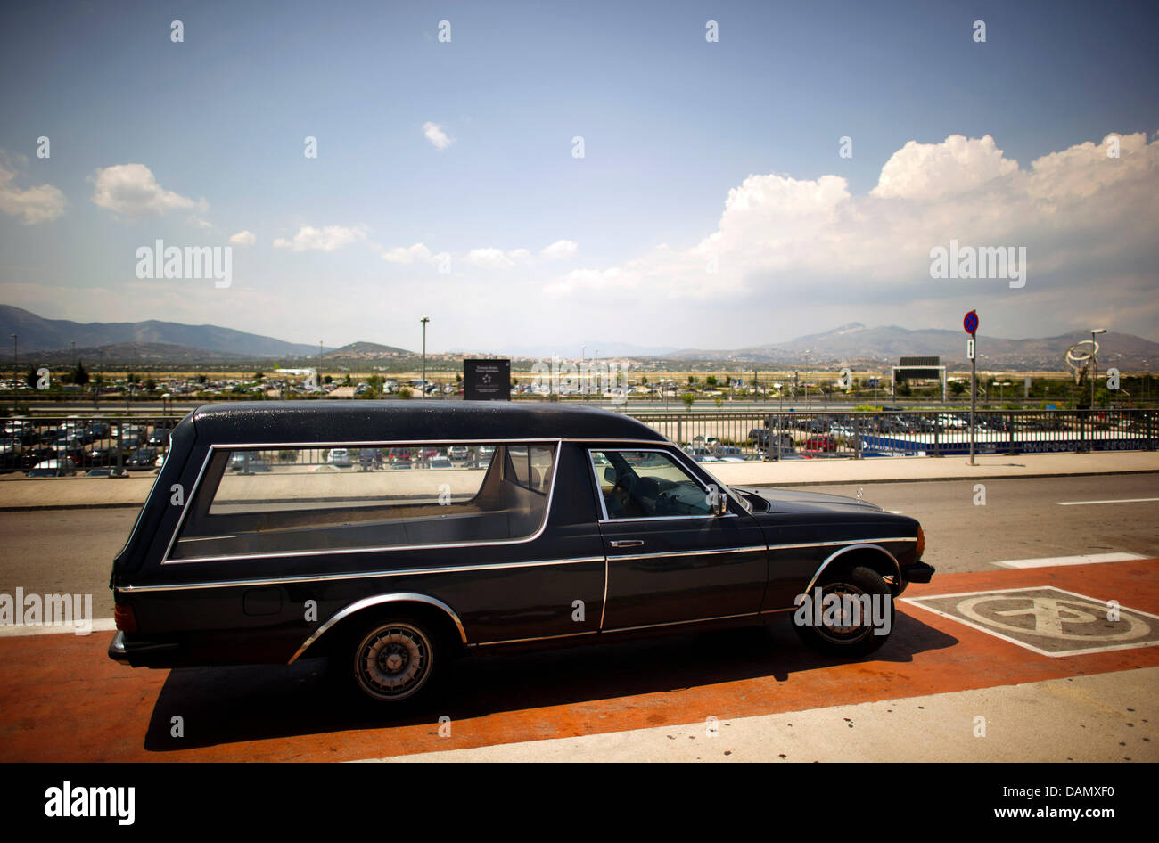 An old Mercedes Benz hearse stands in front of the airport in Athens ...