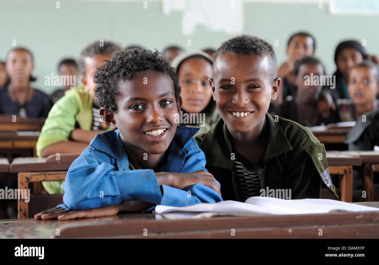 Children sit inside their classroom at the school's official opening in ...