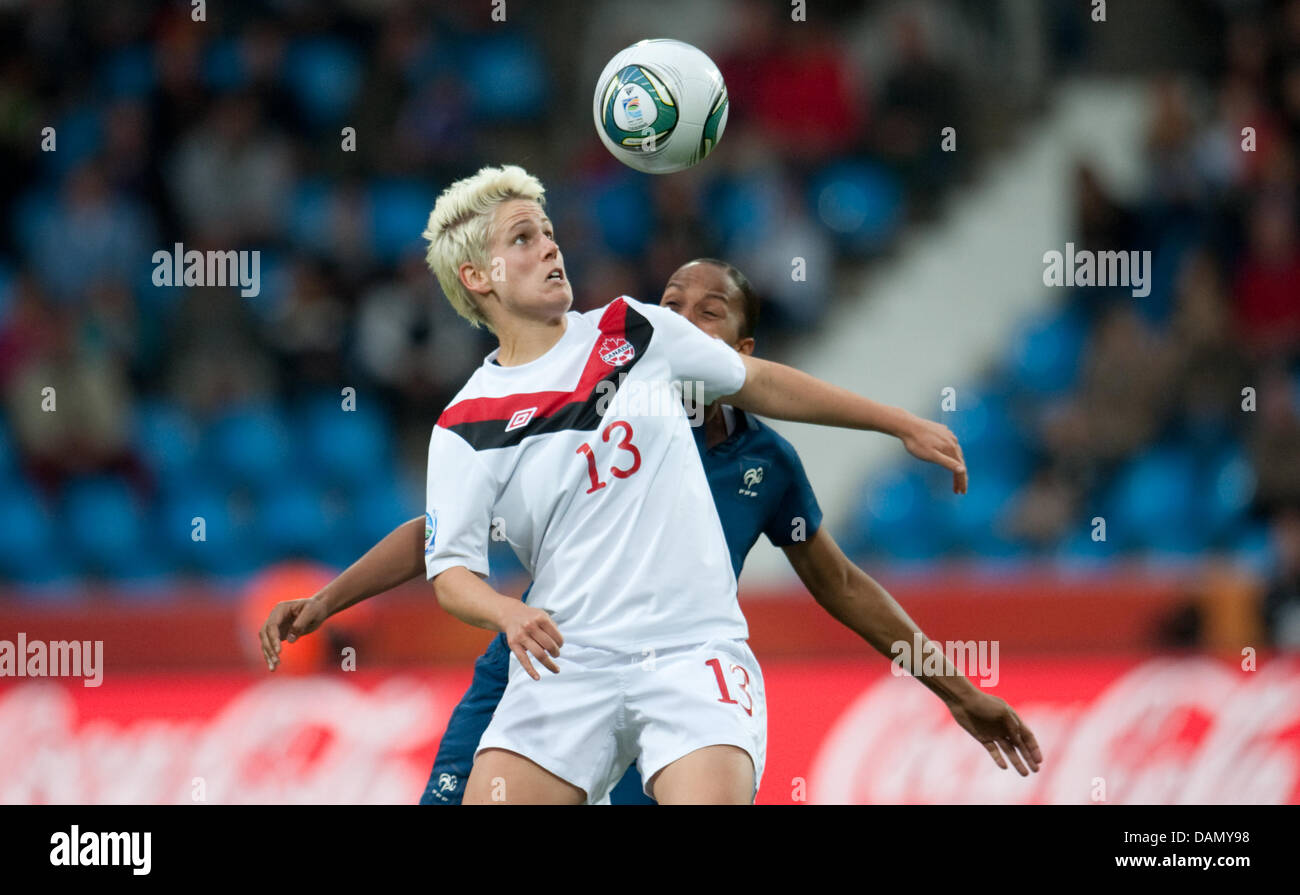Marie-Laure Delie of France (back) and Sophie Schmidt of Canada fight ...
