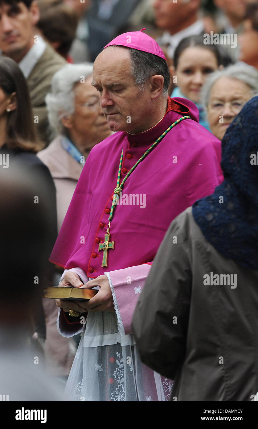 Superior general of the Pius Society, bishop Bernard Fellay (C), takes ...