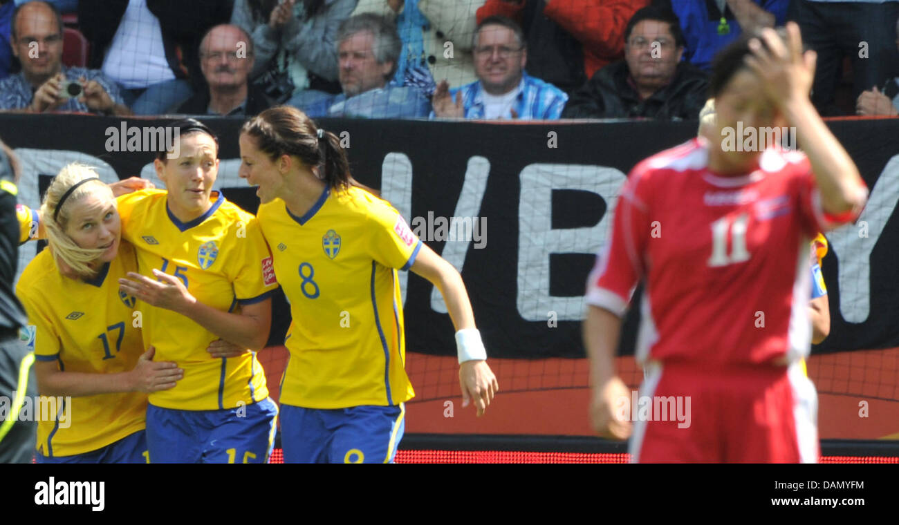 Lisa Dahlkvist (l-r), Therese Sjogran and Lotta Schelin of Sweden ...