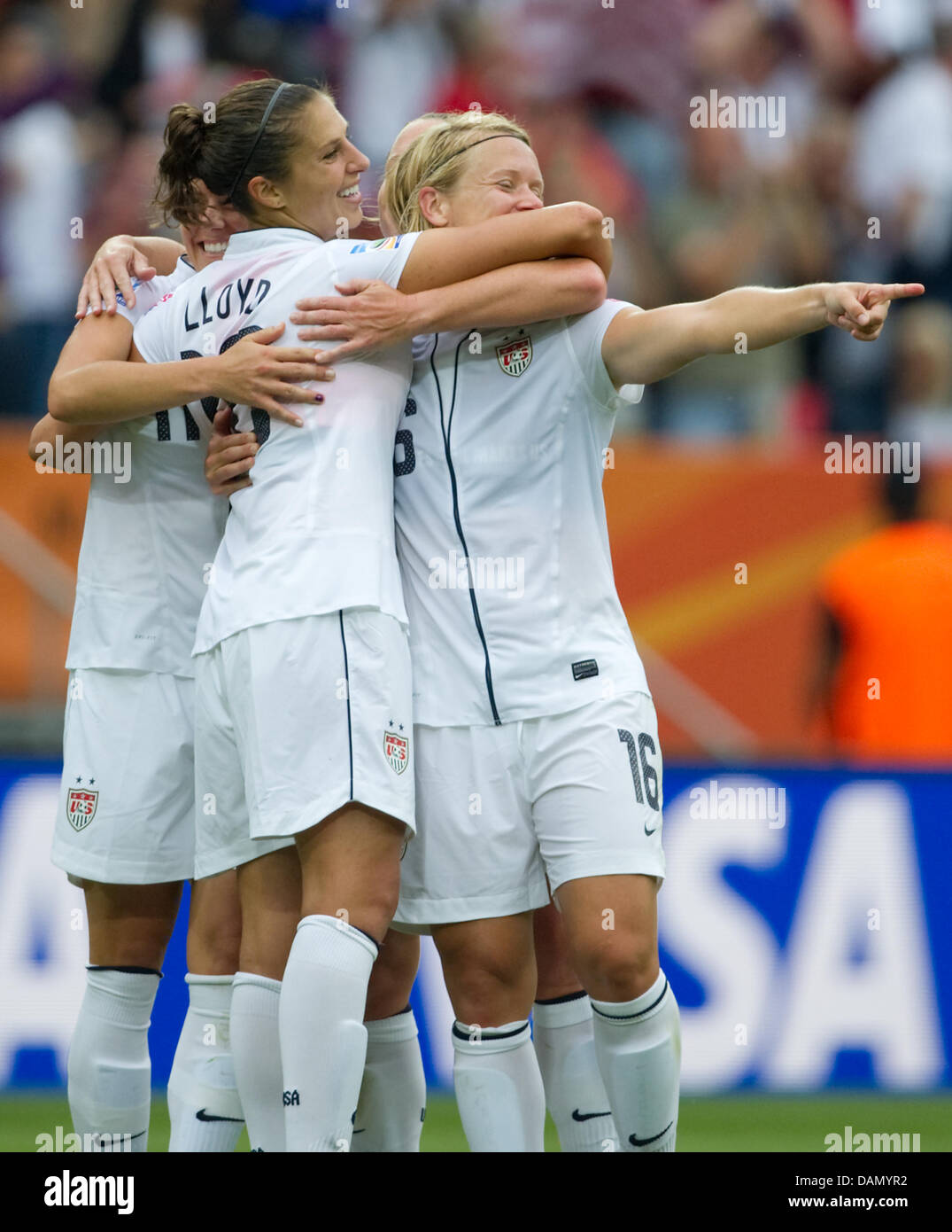 Carli Lloyd (L) and Lori Lindsey (R) of USA celebrate the 2-0 of Rapinoe during the Group C ...