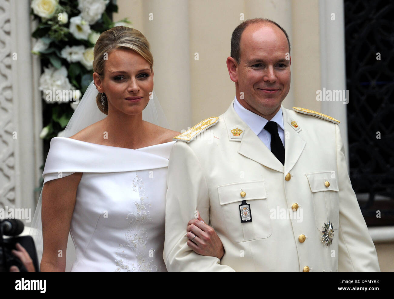 Prince Albert II and Princess Charlene of Monaco leave the Saint Devote ...