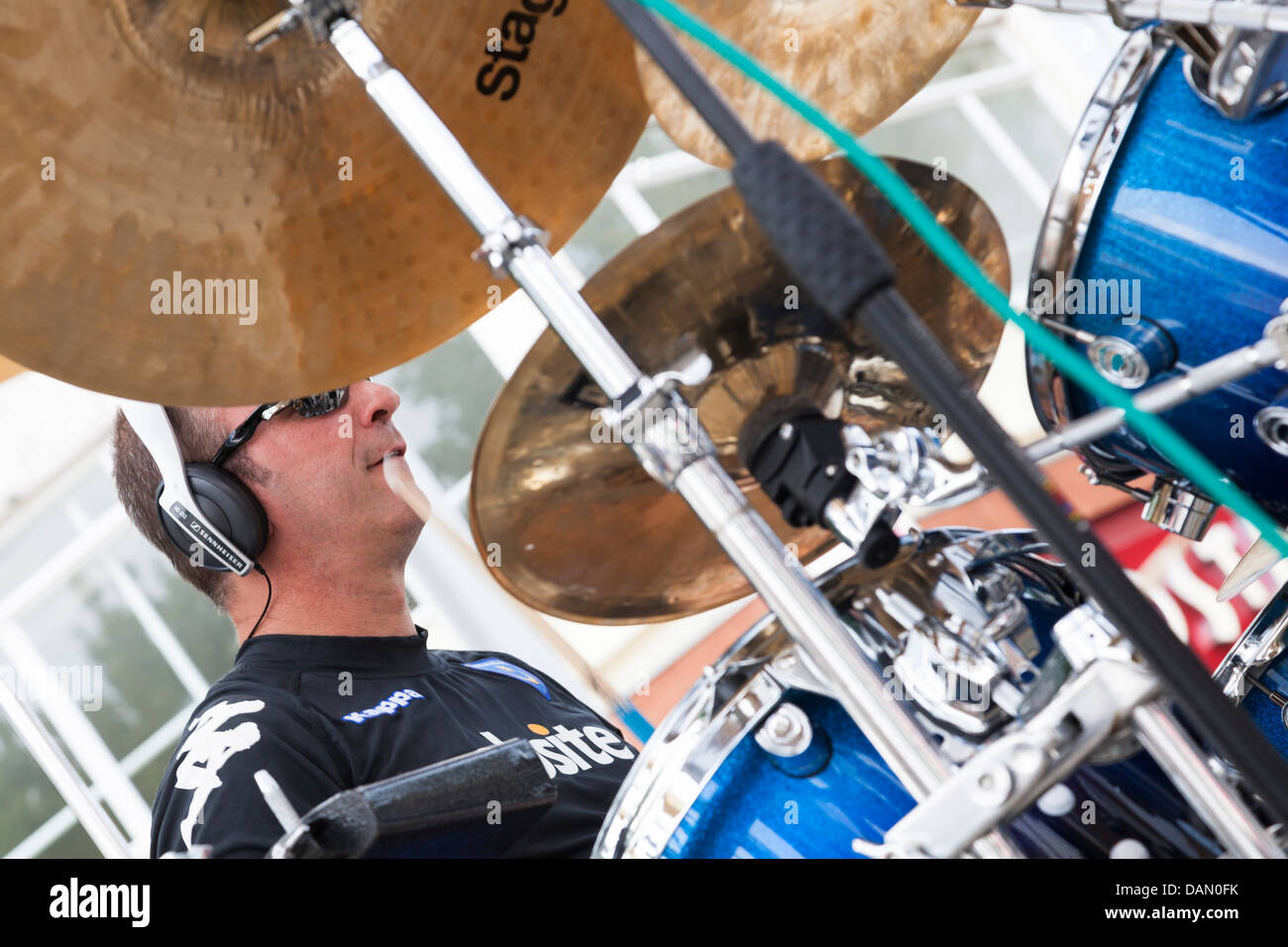 drummer behind symbols and drums Stock Photo - Alamy