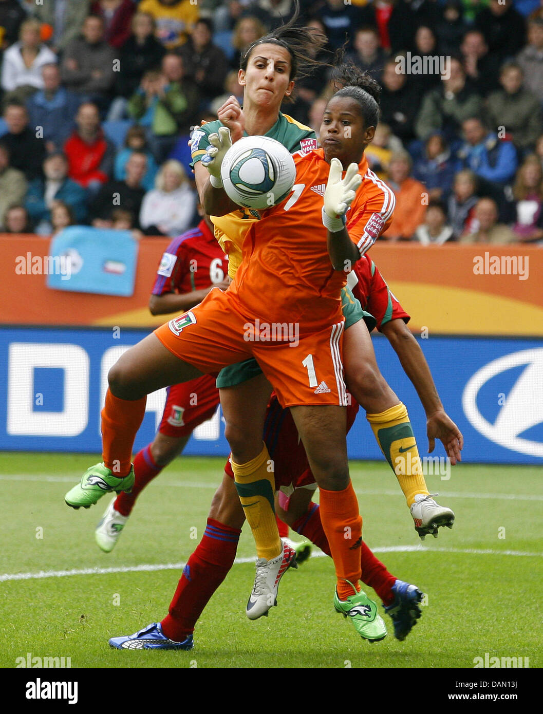 Leena Khamis of Australia (L) and goalkeeper Miriam (r) of Equatorial ...