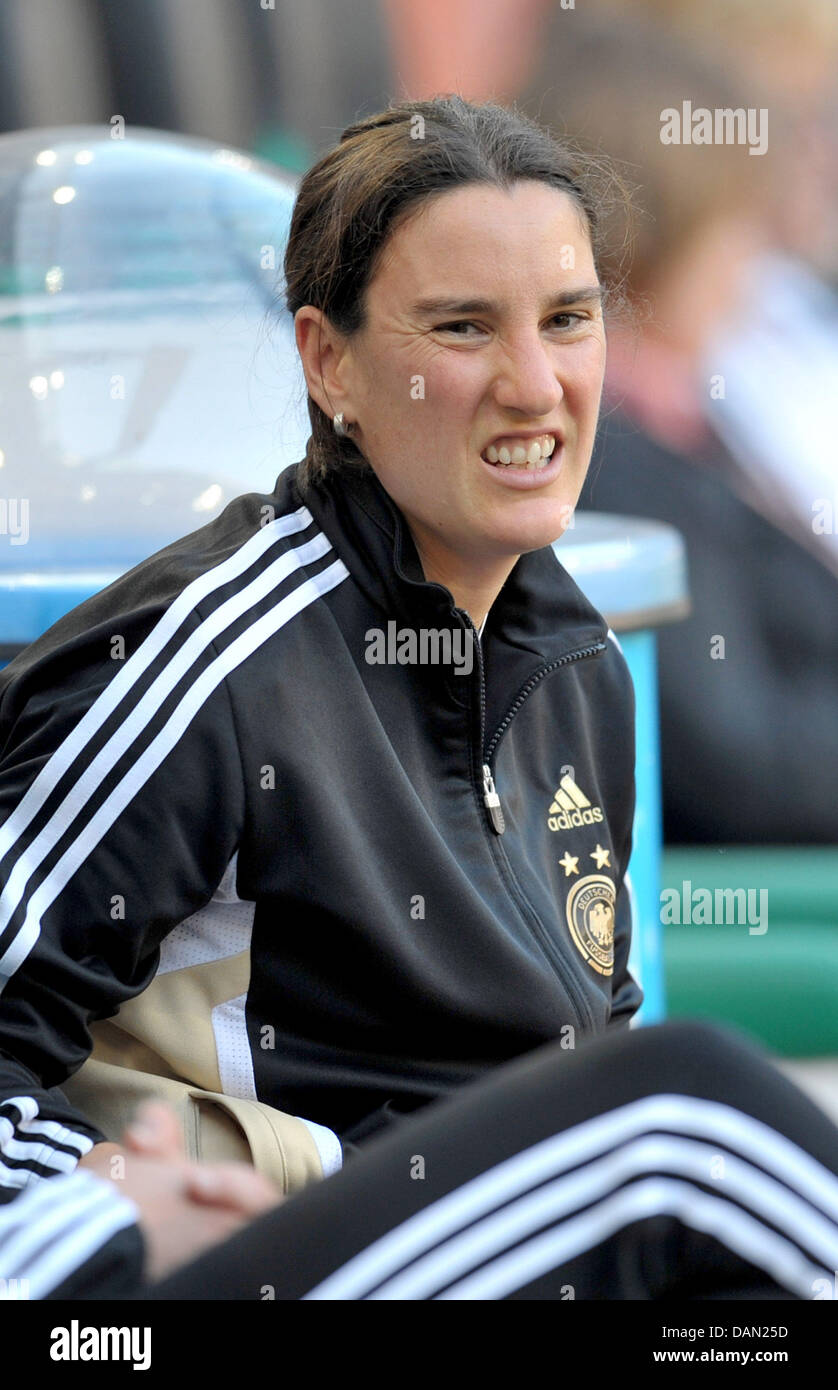 Player on the German national soccer team, Birgit Prinz, sits on the ...