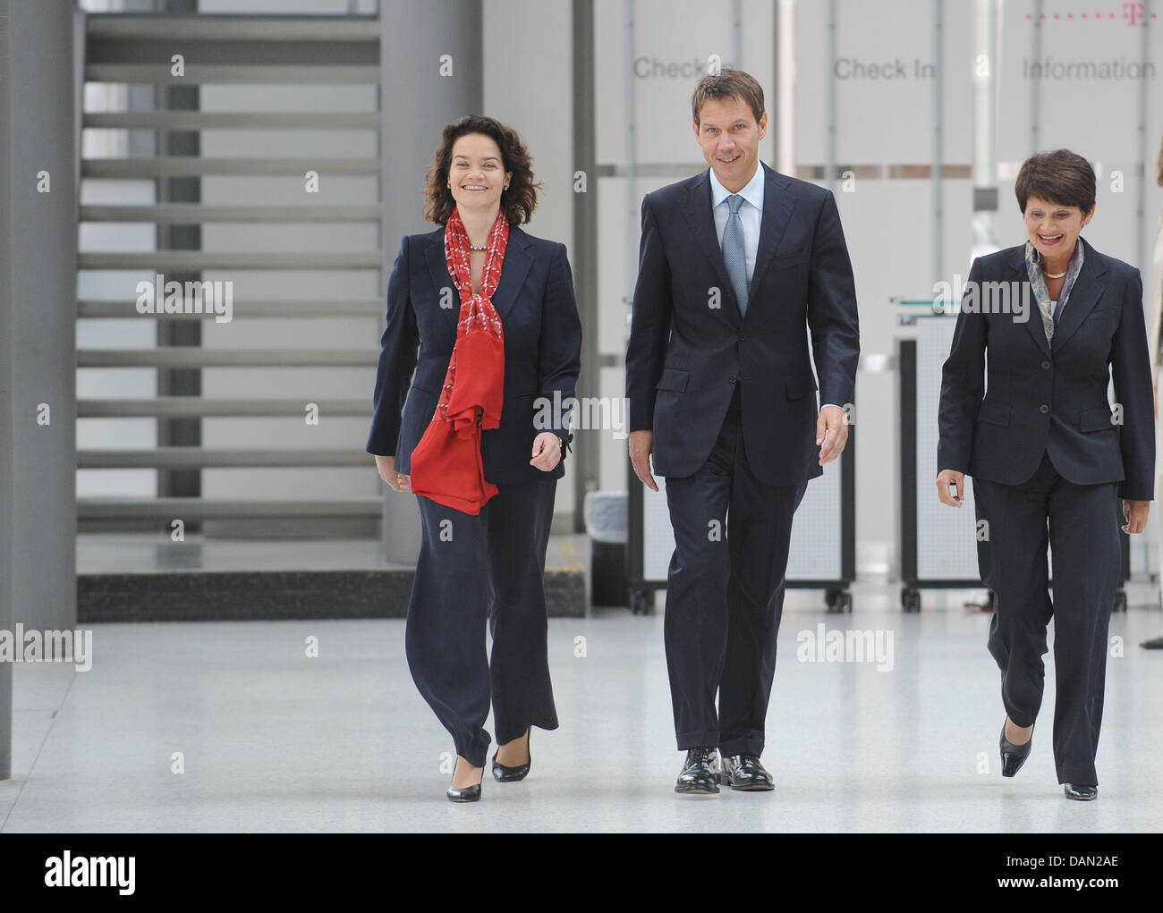 The head of Telekom, Rene Obermann (m) arrives for a press conference ...