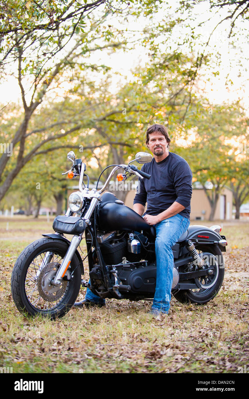 USA, Texas, Mature man sitting on motorcycle, portrait Stock Photo - Alamy