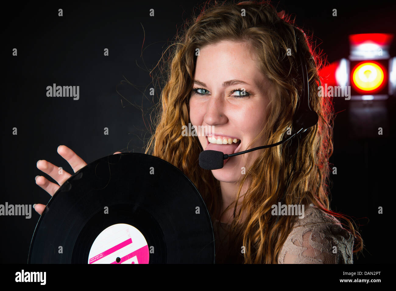 Young woman with headset, smiling, close up Stock Photo - Alamy