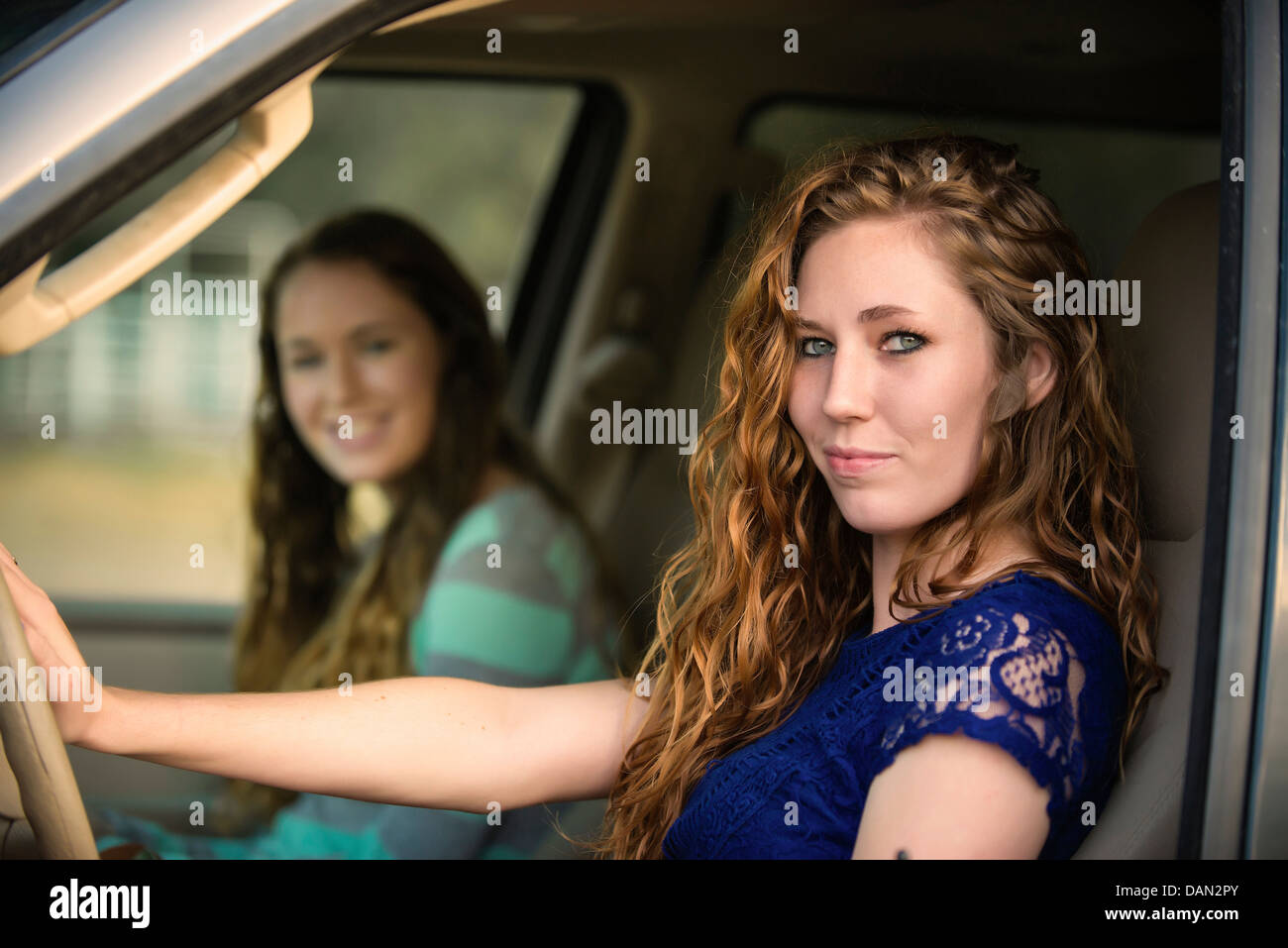 USA, Texas, Sisters sitting in car, smiling Stock Photo - Alamy