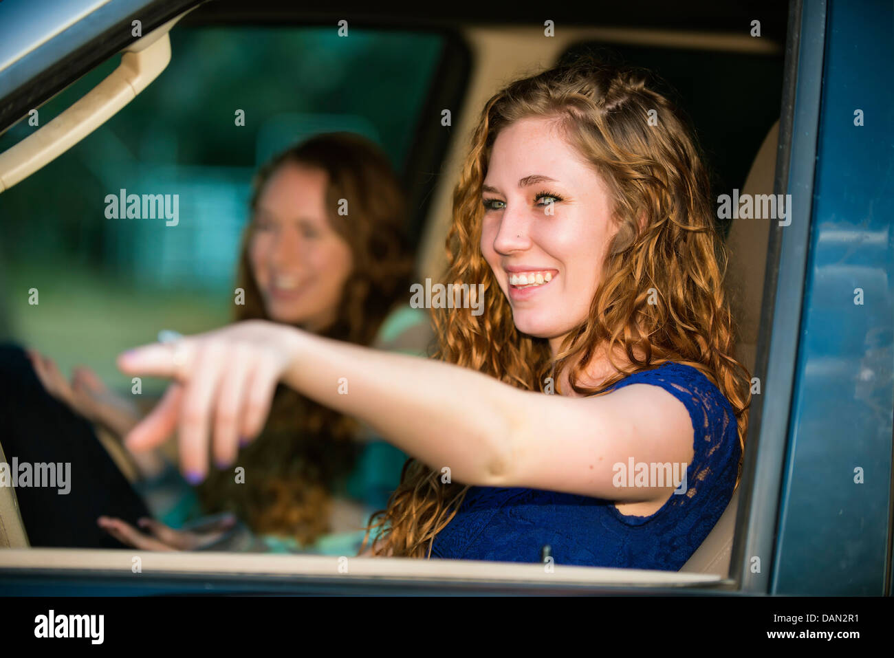 USA, Texas, Sisters sitting in car, smiling Stock Photo - Alamy