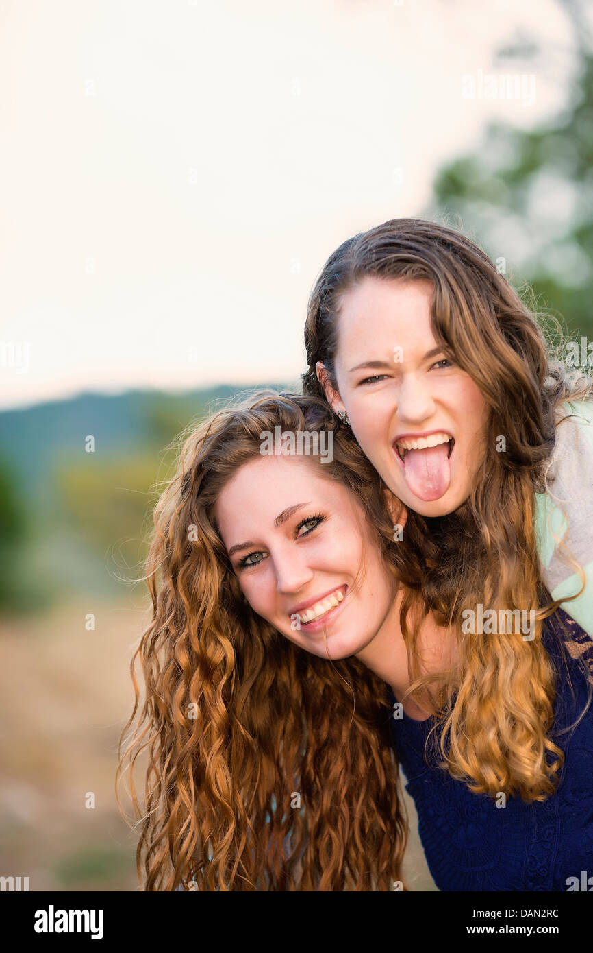 USA, Texas, Sisters smiling, portrait Stock Photo - Alamy