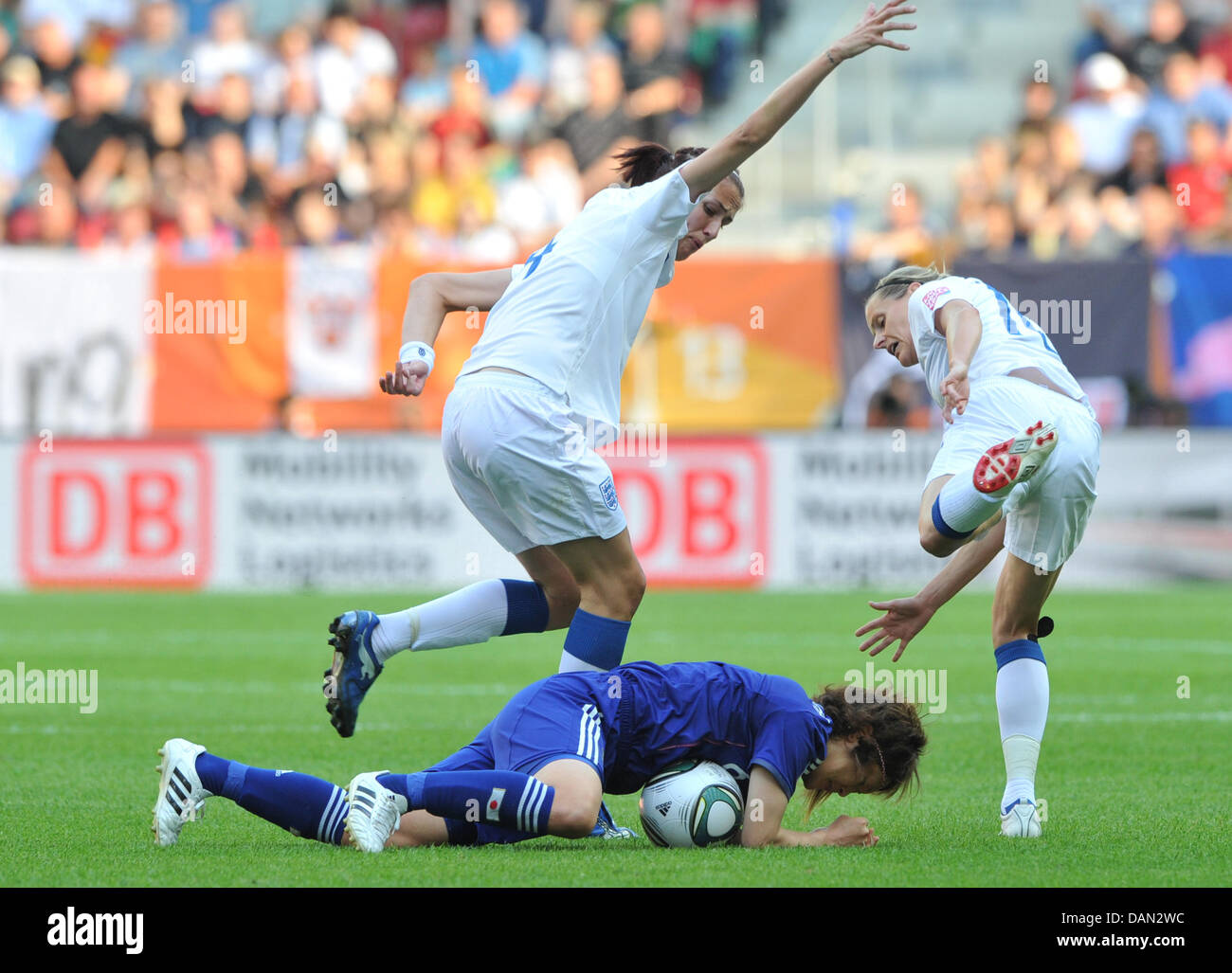 Jill Scott (l) and Kelly Smith (r) of England and Mizuho Sakaguchi (M ...