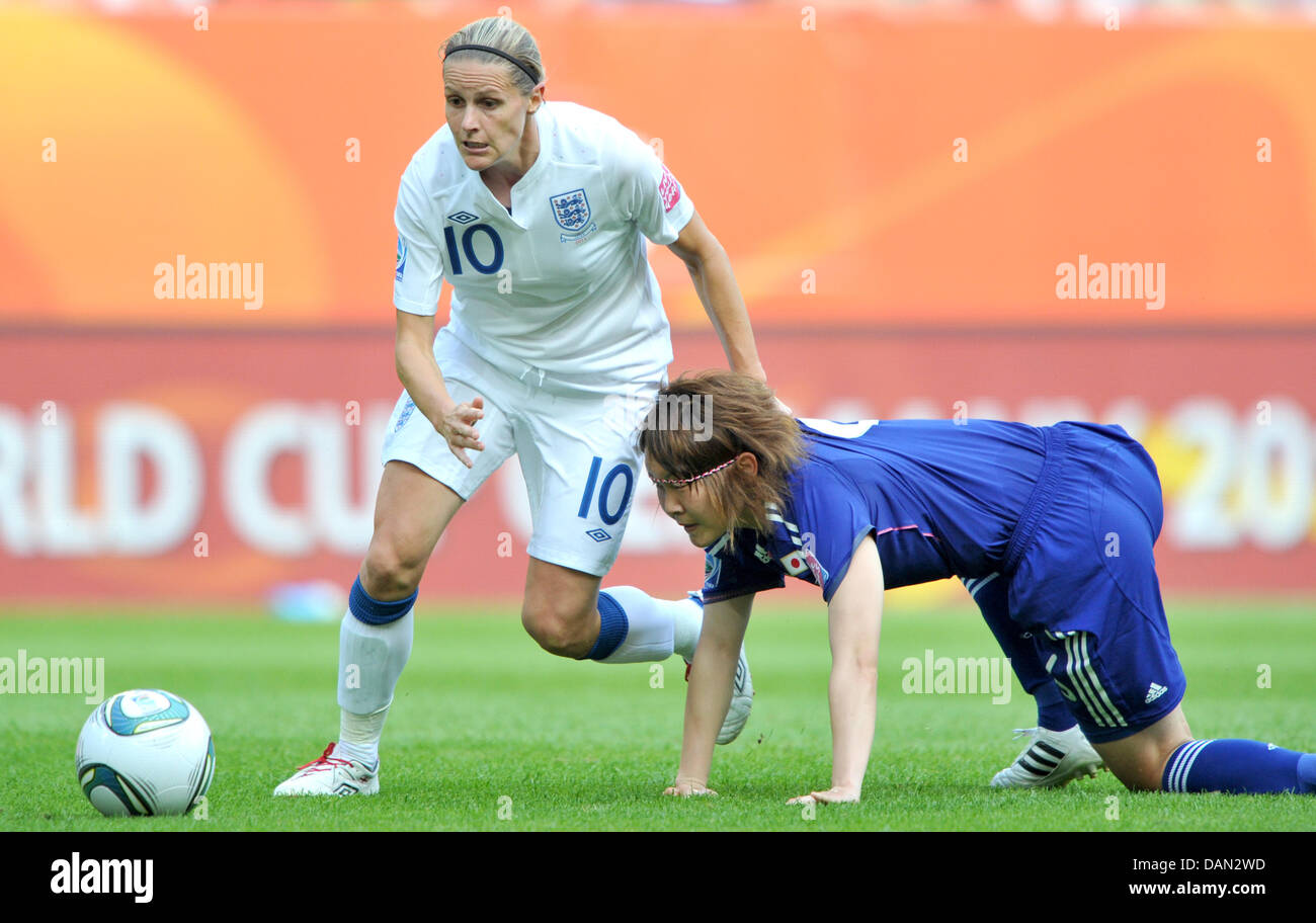 Kelly Smith (l) of England and Mizuho Sakaguchi of Japan fight for the ...
