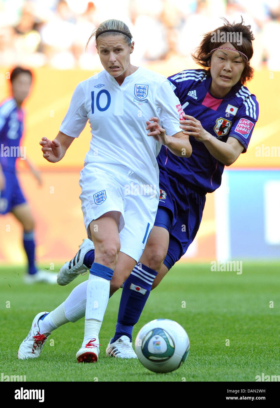 Kelly Smith (l) of England and Mizuho Sakaguchi (r) of Japan fight for ...