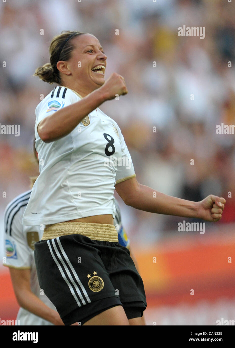 Germany's Inka Grings celebrates scoring the 2-0 during the Group A ...