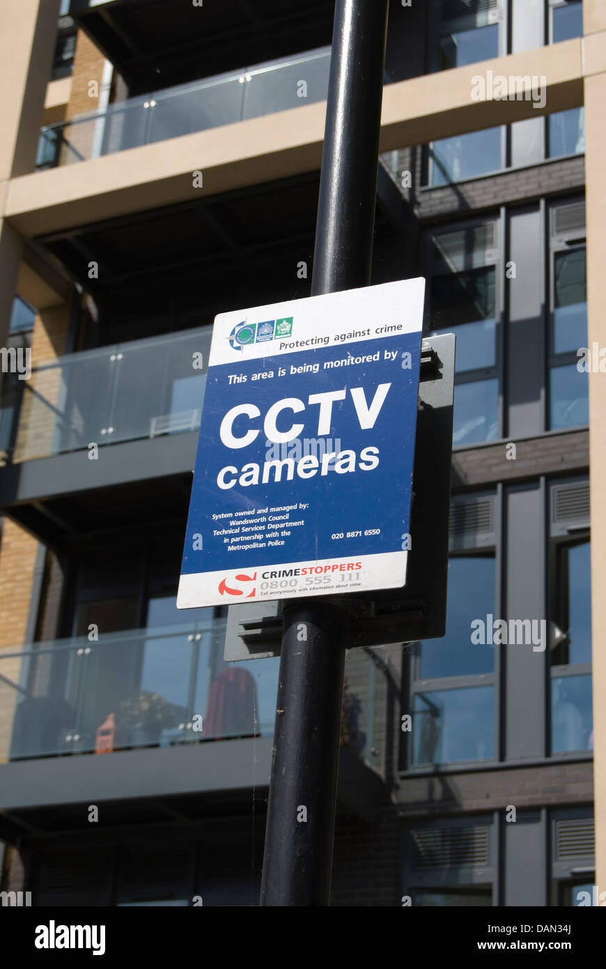 cctv cameras warning sign in front of a modern apartment block in ...