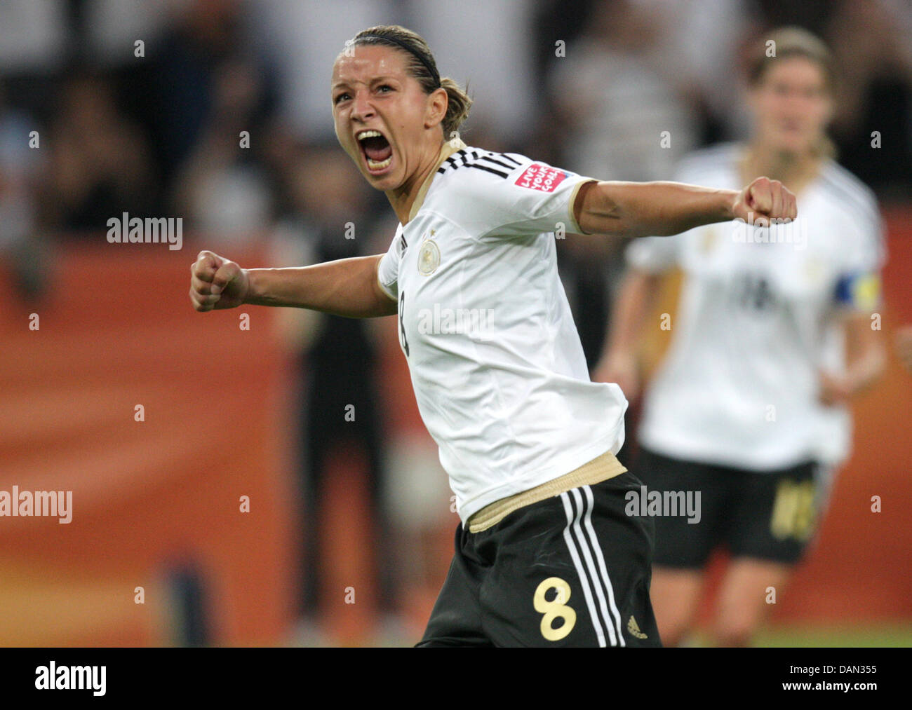 Inka Grings of Germany celebrates after scoring the 3-2 through penalty ...
