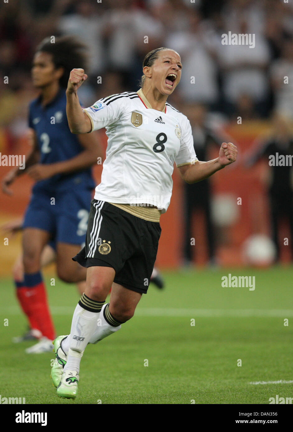 Inka Grings of Germany celebrates after scoring the 3-2 through penalty ...