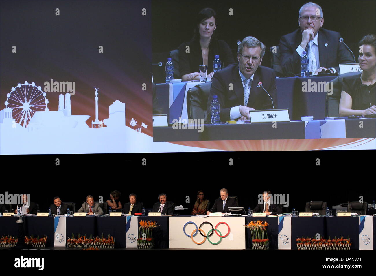 IOC members with IOC president Jacques Rogge (C) sit on the stage ...