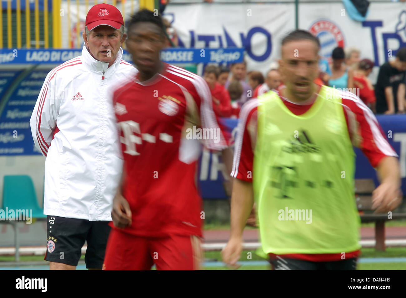 FC Bayern Munich's head coach Jupp Heynckes (L) watches his players ...
