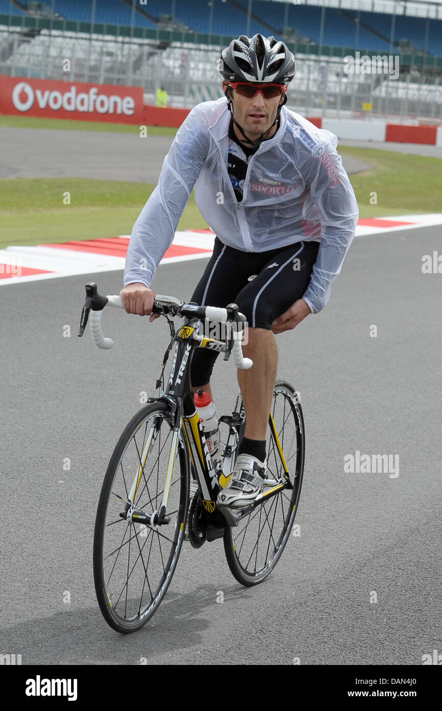 Australian Formula One driver Mark Webber of Red Bull cycles on the ...